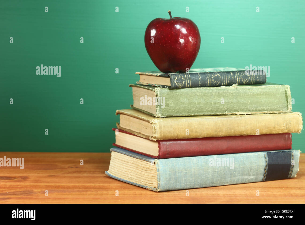 Back to School Books and Apple With Chalkboard Stock Photo - Alamy