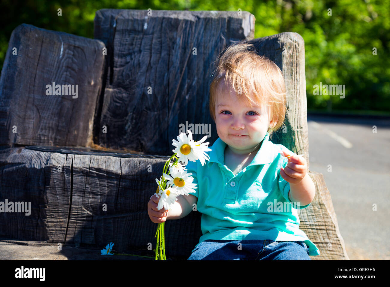 Boy Playing with Flowers Stock Photo - Alamy