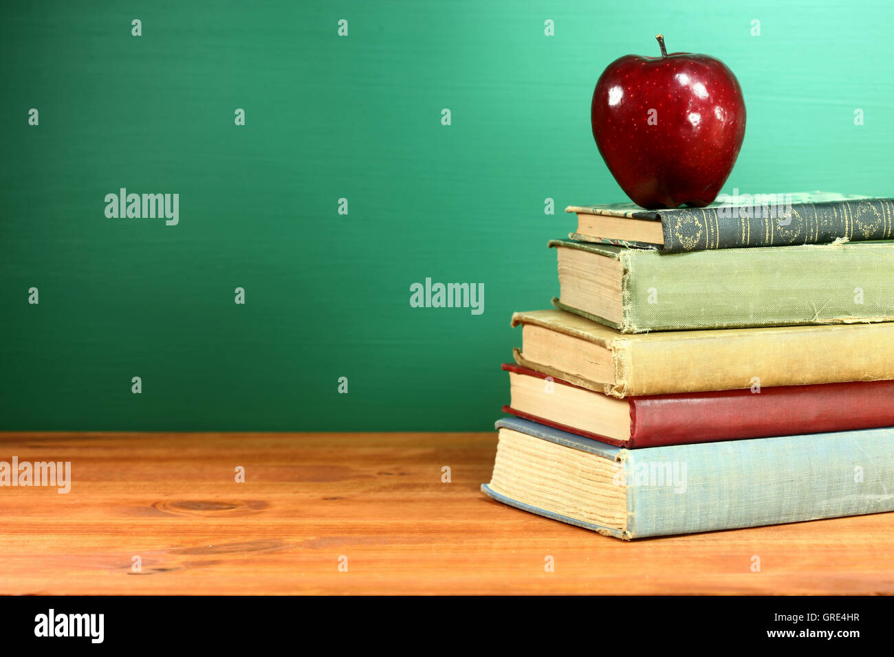Back to School Books and Apple With Chalkboard Stock Photo - Alamy
