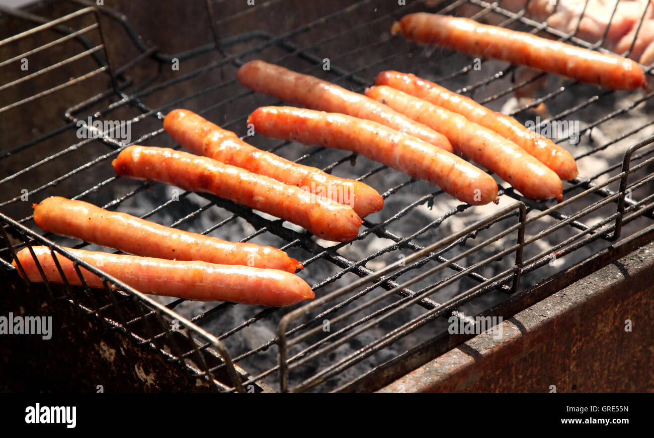 A few sausages on grill closed-up Stock Photo - Alamy