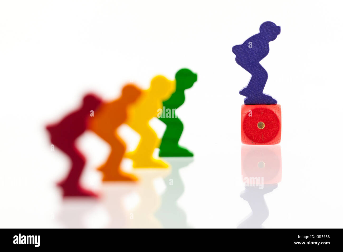 Five colored pawns isolated on a white background Stock Photo - Alamy
