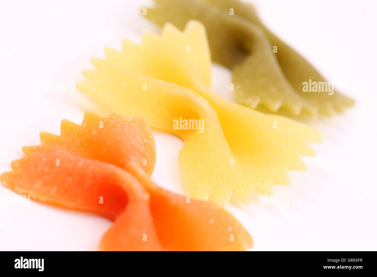 Close-up pasta farfalle three colors are located Stock Photo - Alamy