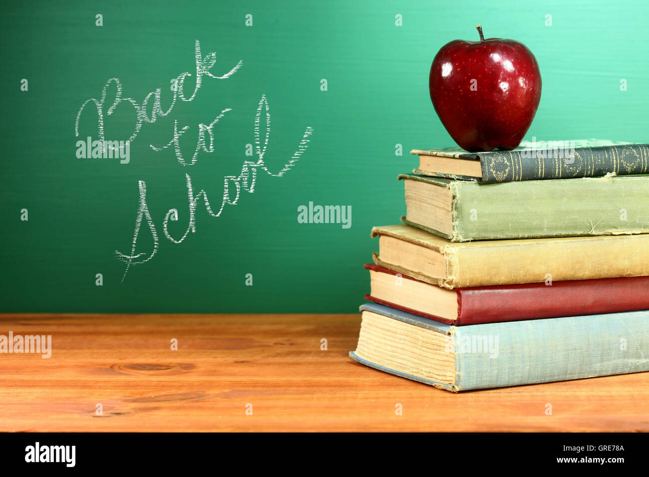 Back to School Books and Apple With Chalkboard Stock Photo - Alamy