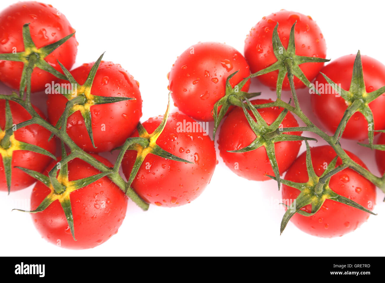 Two clusters of small red tomatoes Stock Photo - Alamy