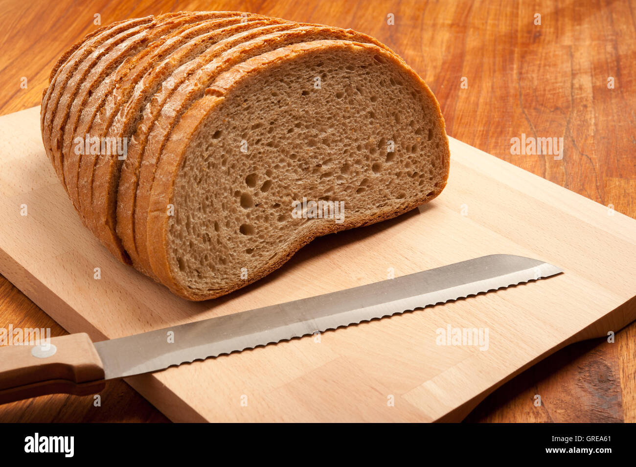 bread sliced on a cutter Stock Photo - Alamy