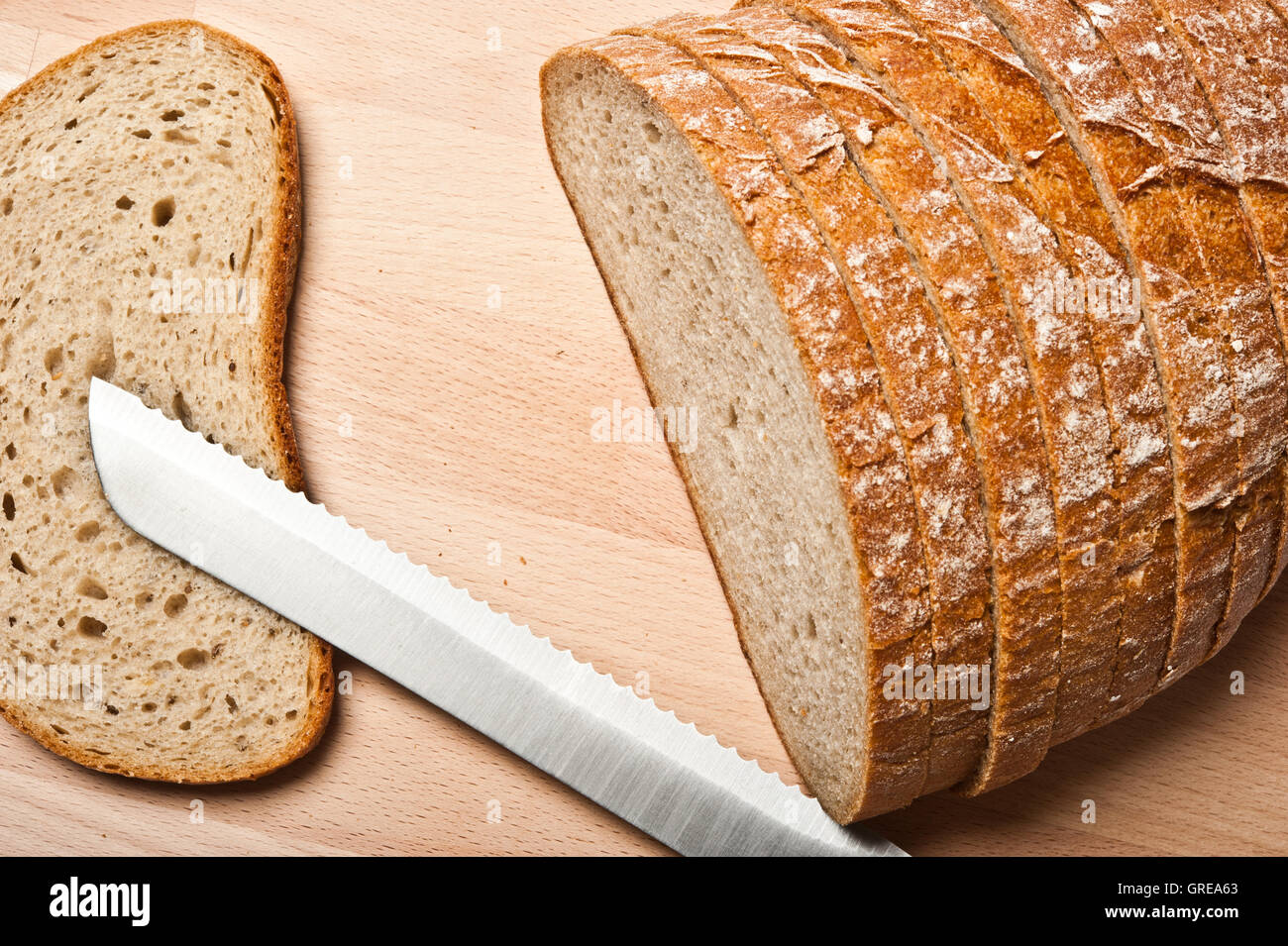 loaf of bread cut in slices Stock Photo - Alamy