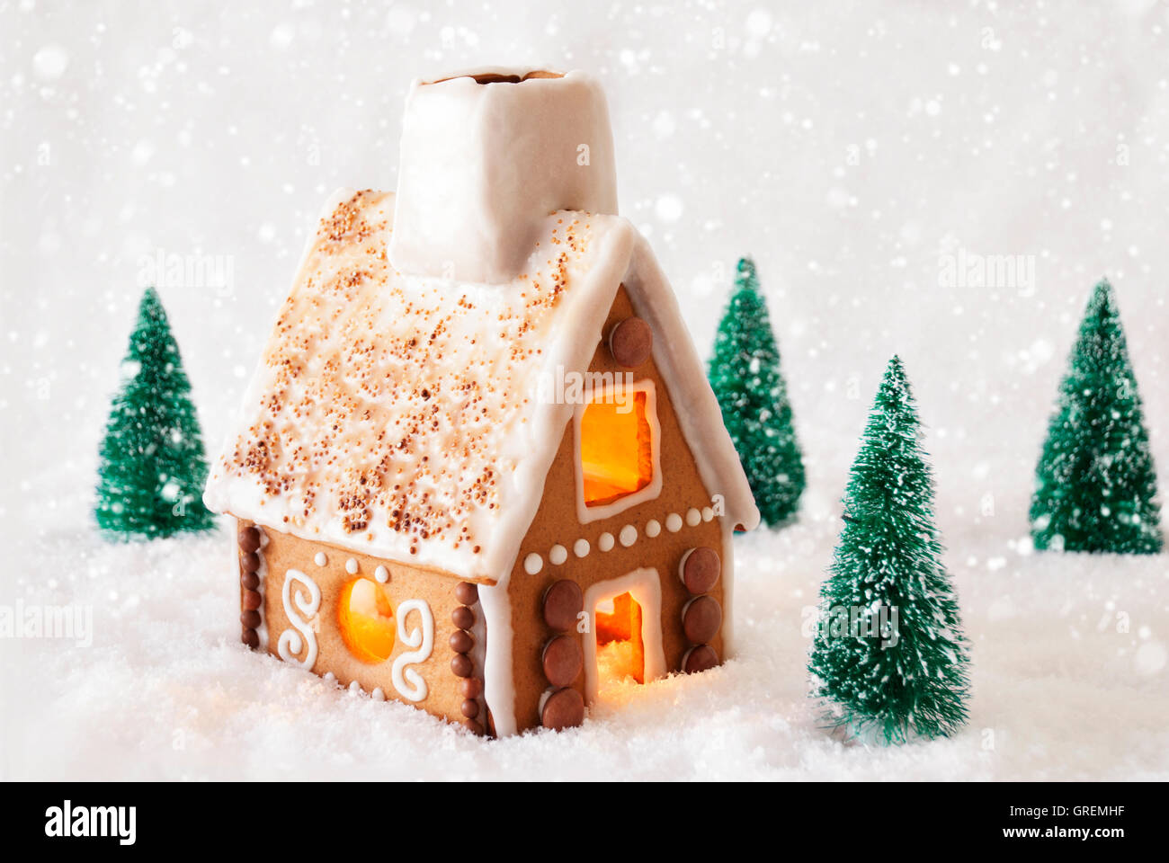 Gingerbread House On Snow With Snowflakes And White Background Stock ...