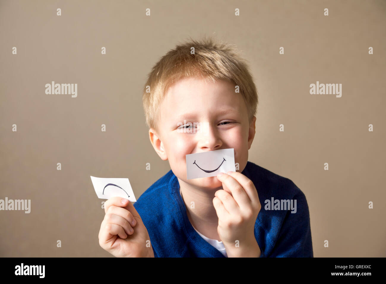 Young boy (teen) select between positive and negative expressions Stock ...