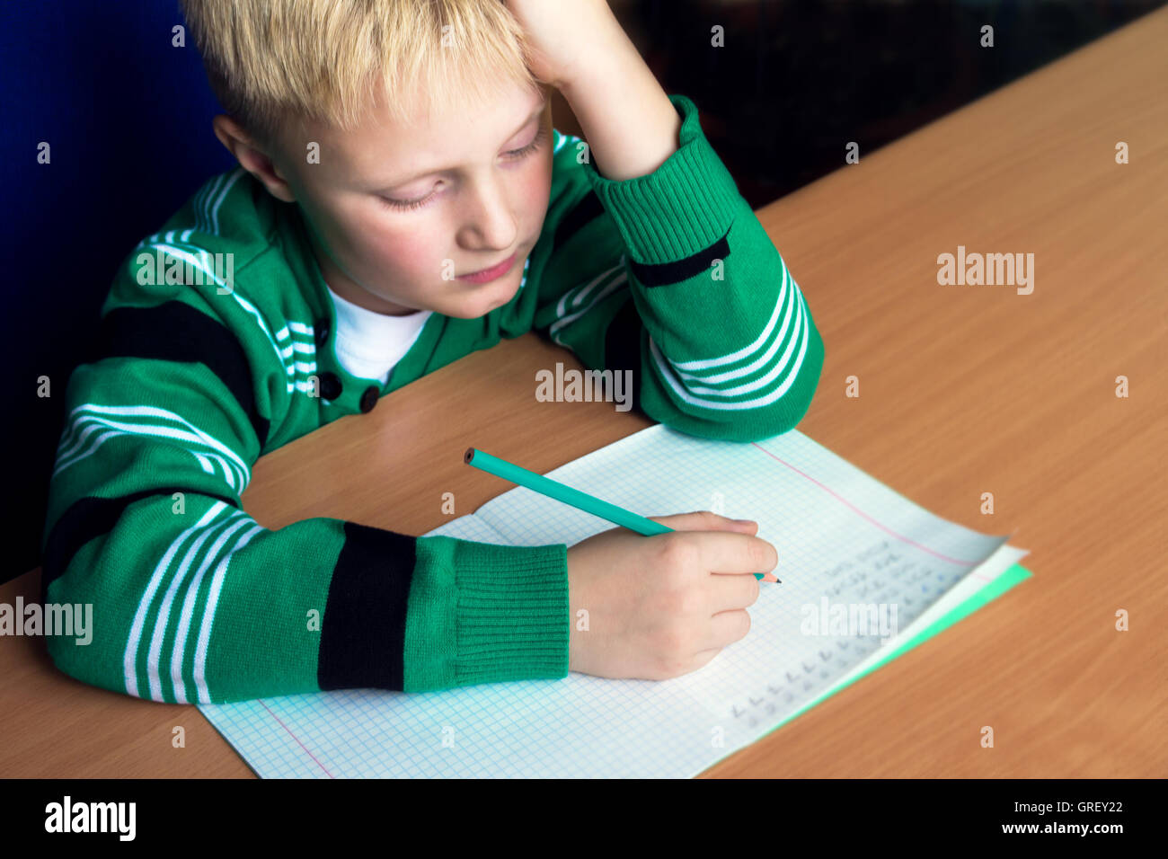 Tired boring boy doing his difficult school homework Stock Photo - Alamy