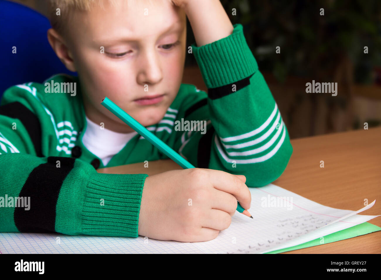 Tired boring boy doing his difficult school homework Stock Photo - Alamy