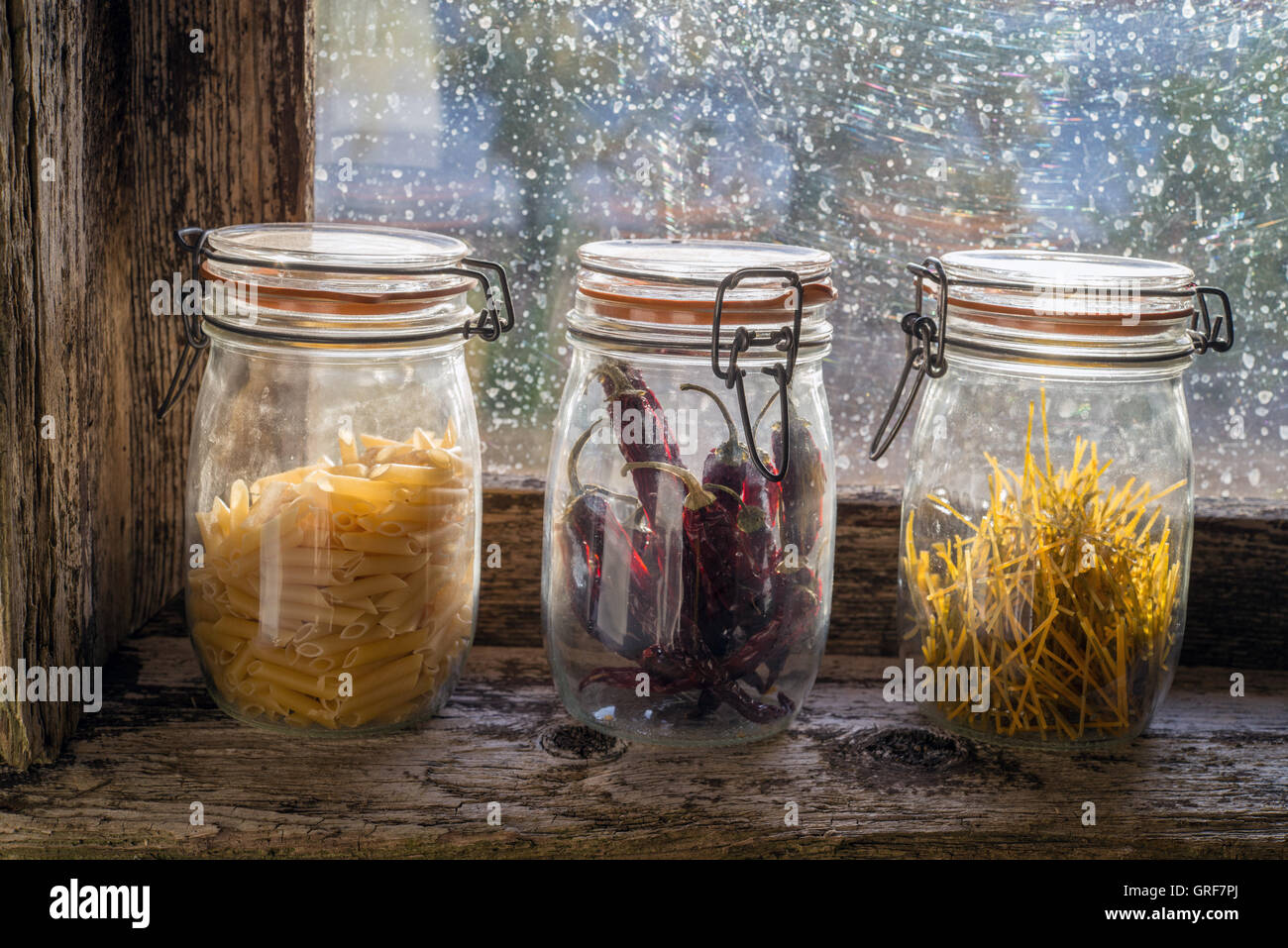 Pantry in the windowsill of an old window Stock Photo - Alamy