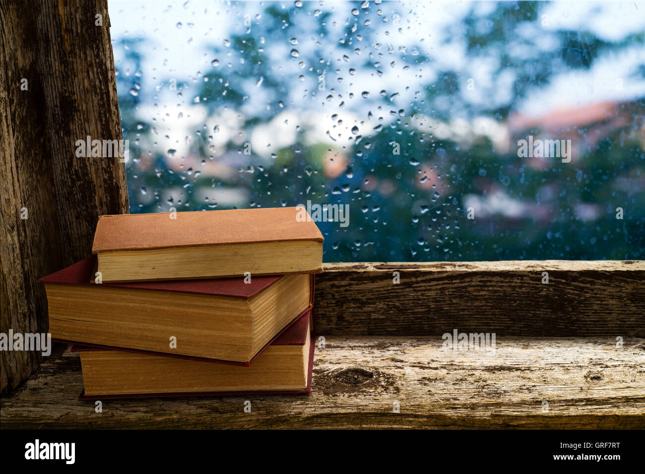 books on the windowsill of an old wooden window Stock Photo - Alamy