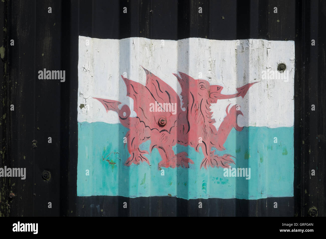 Welsh flag painted on a metal door Stock Photo - Alamy