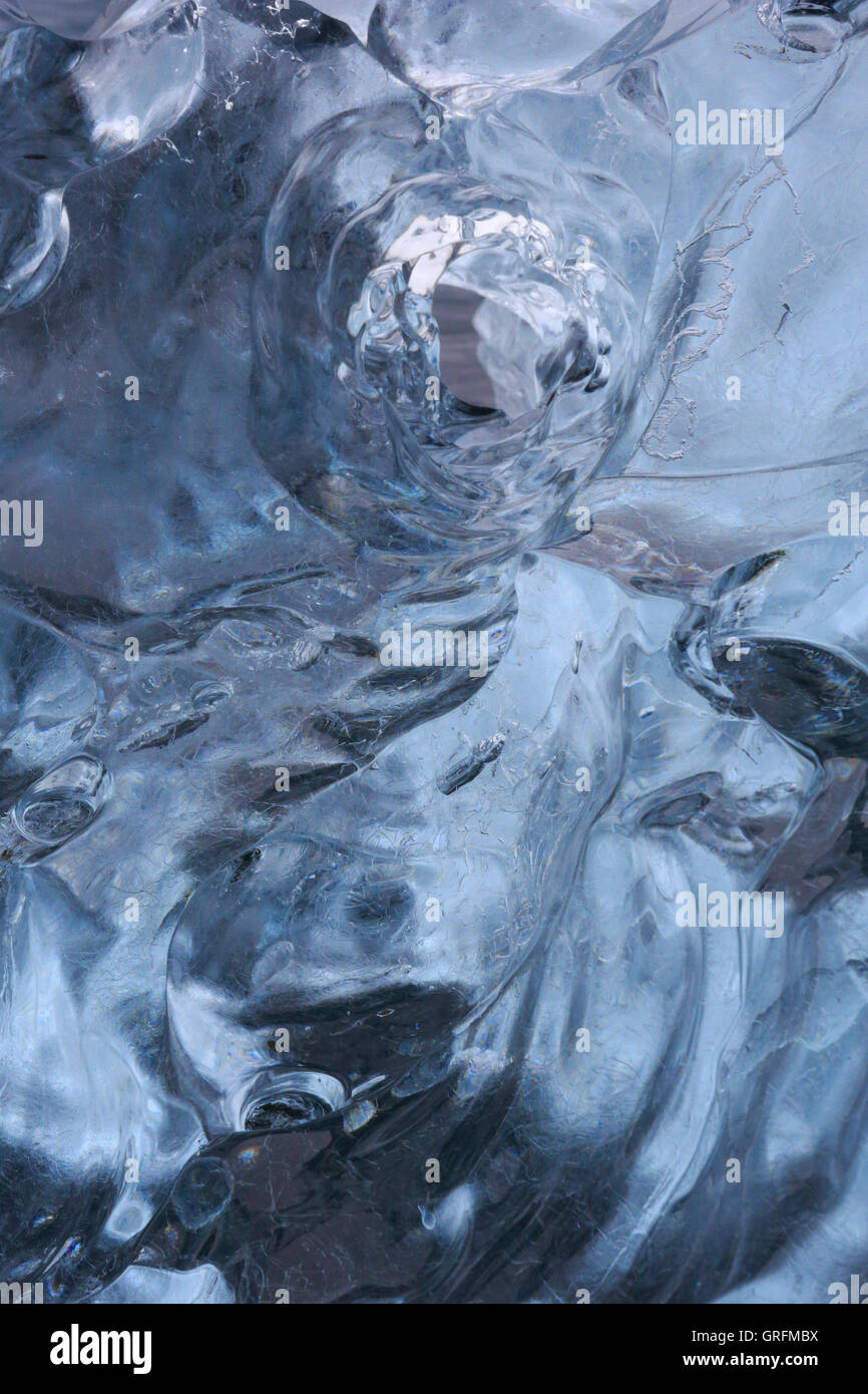 Tunnel through an ice block at the glacier lagoon in Iceland Stock ...