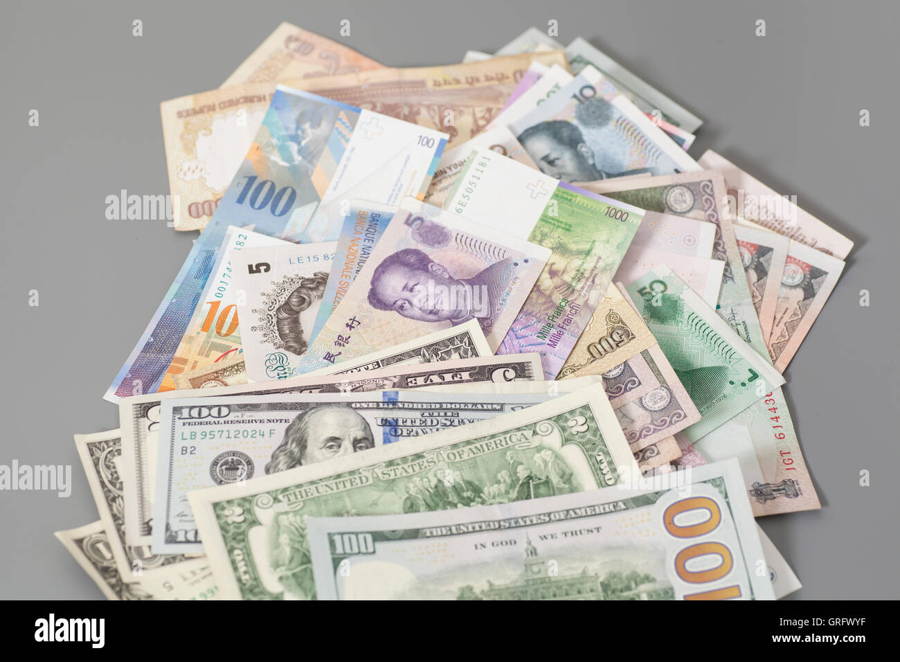 International currencies isolated on gray background Stock Photo - Alamy