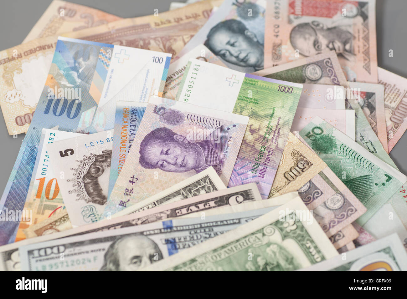 International currencies isolated on gray background Stock Photo - Alamy