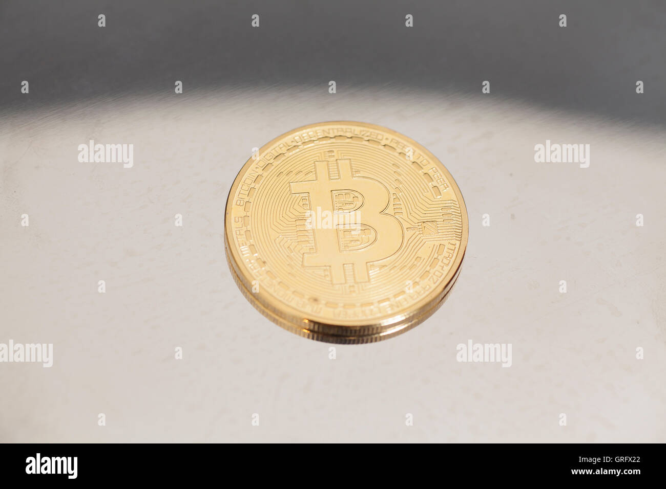 Golden Bitcoin coin on gray background Stock Photo - Alamy