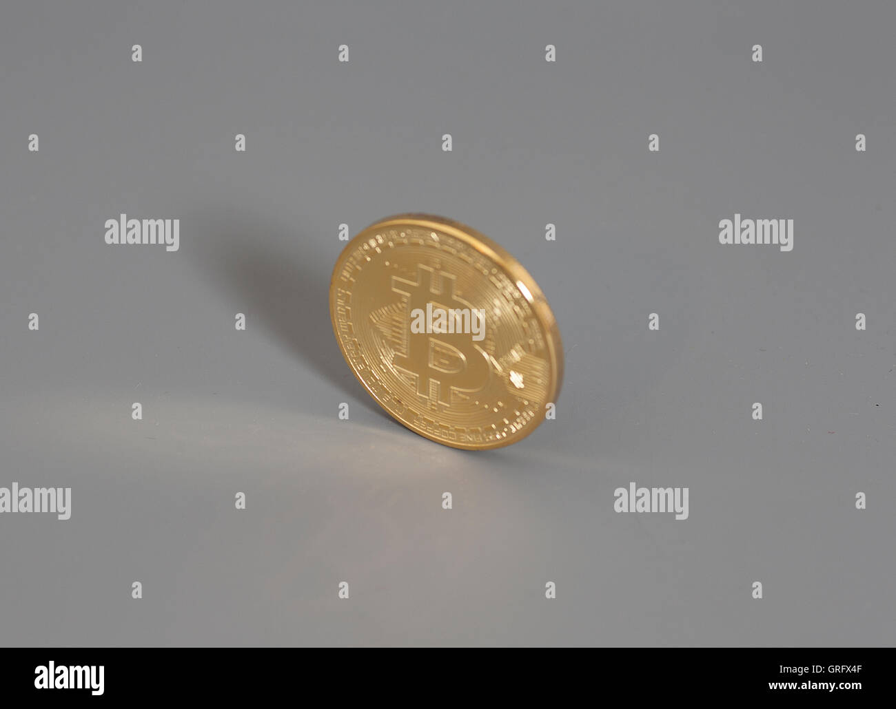 Golden Bitcoin coin on gray background Stock Photo - Alamy