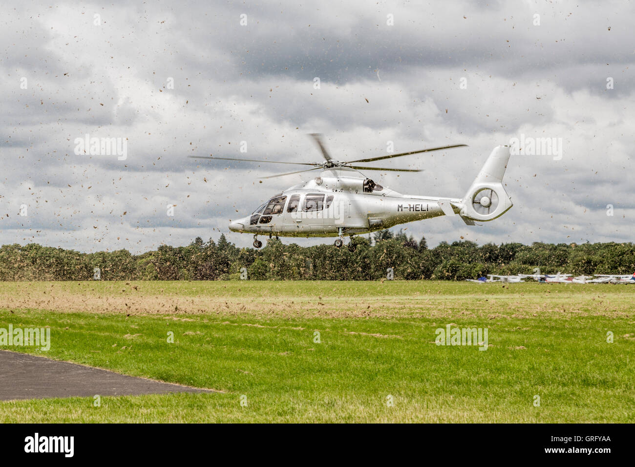 A Eurocopter EC155 B1 helicopter hover taxis at Denham aerodrome with ...