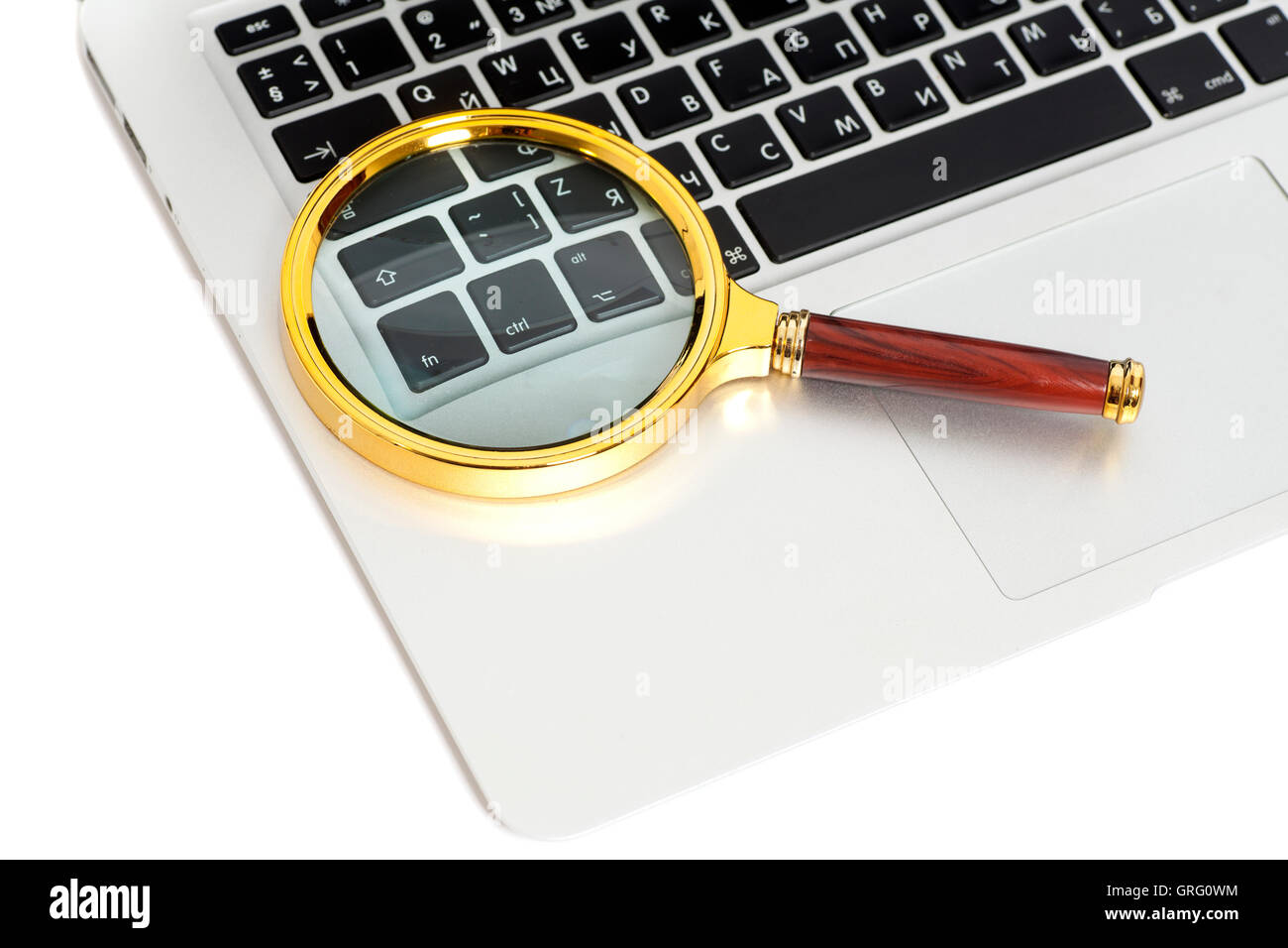 Laptop With Magnifying Glass on white Stock Photo - Alamy