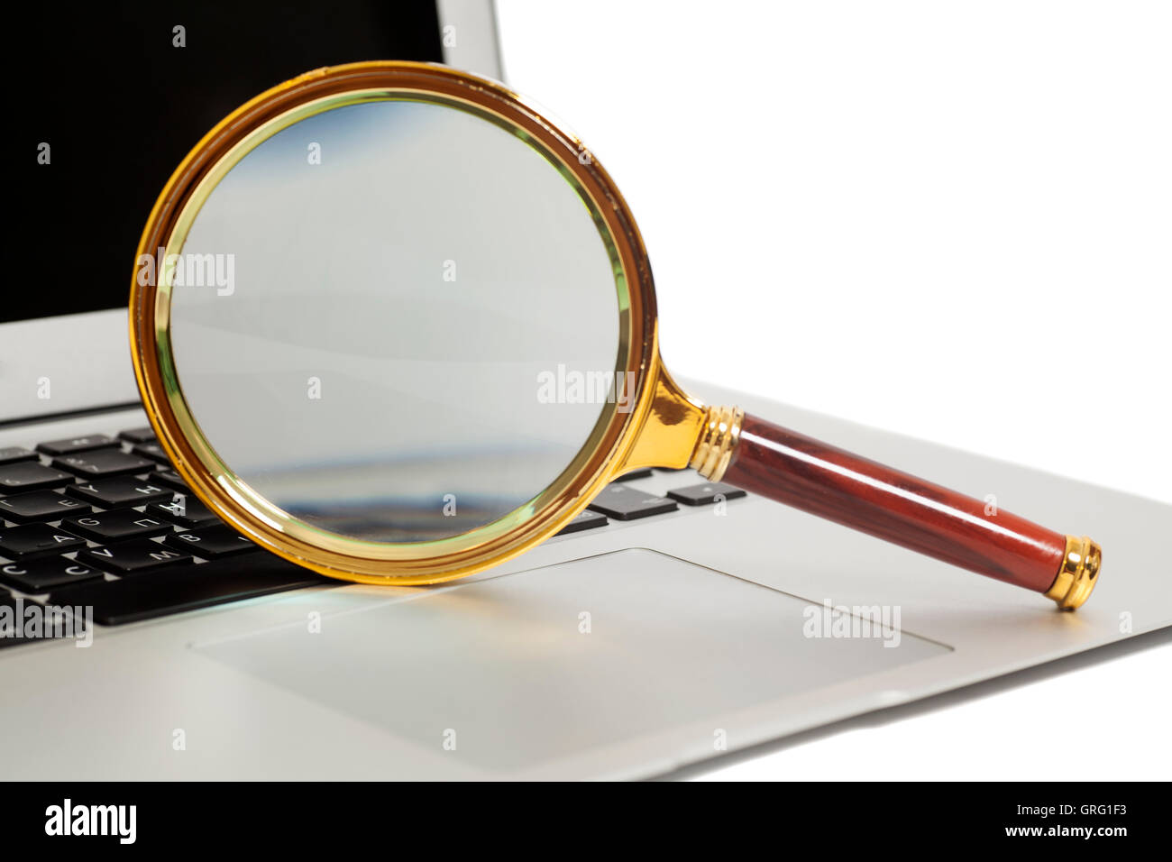 Laptop With Magnifying Glass isolated on white Stock Photo - Alamy