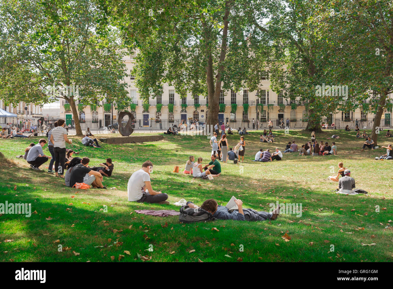 London city square, view on a summer afternoon of people relaxing in ...