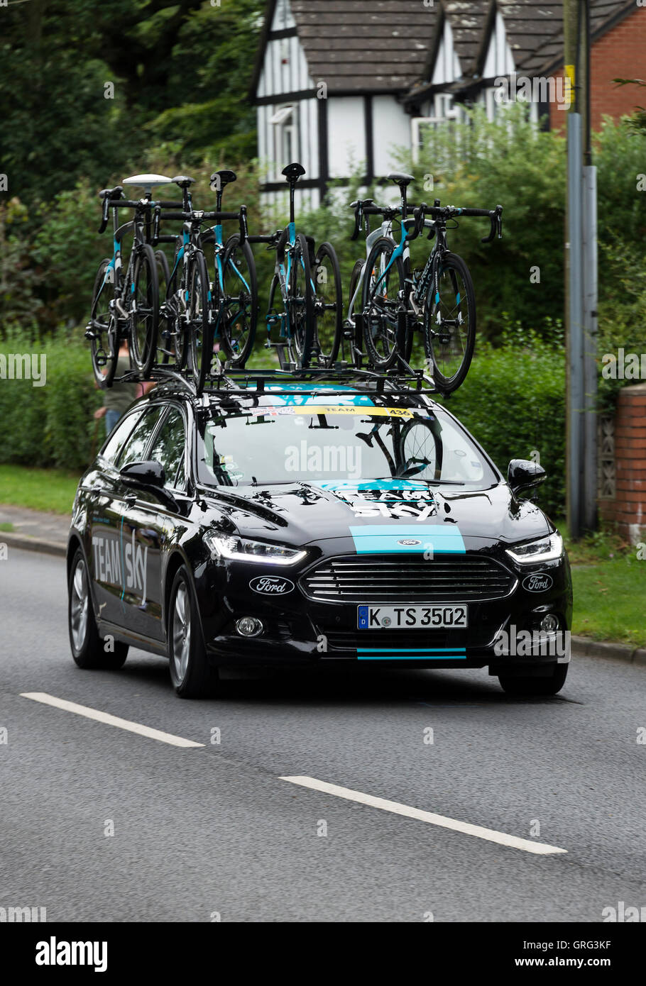 Team Support Cars Following the Tour of Britain Cycle Race Passing ...