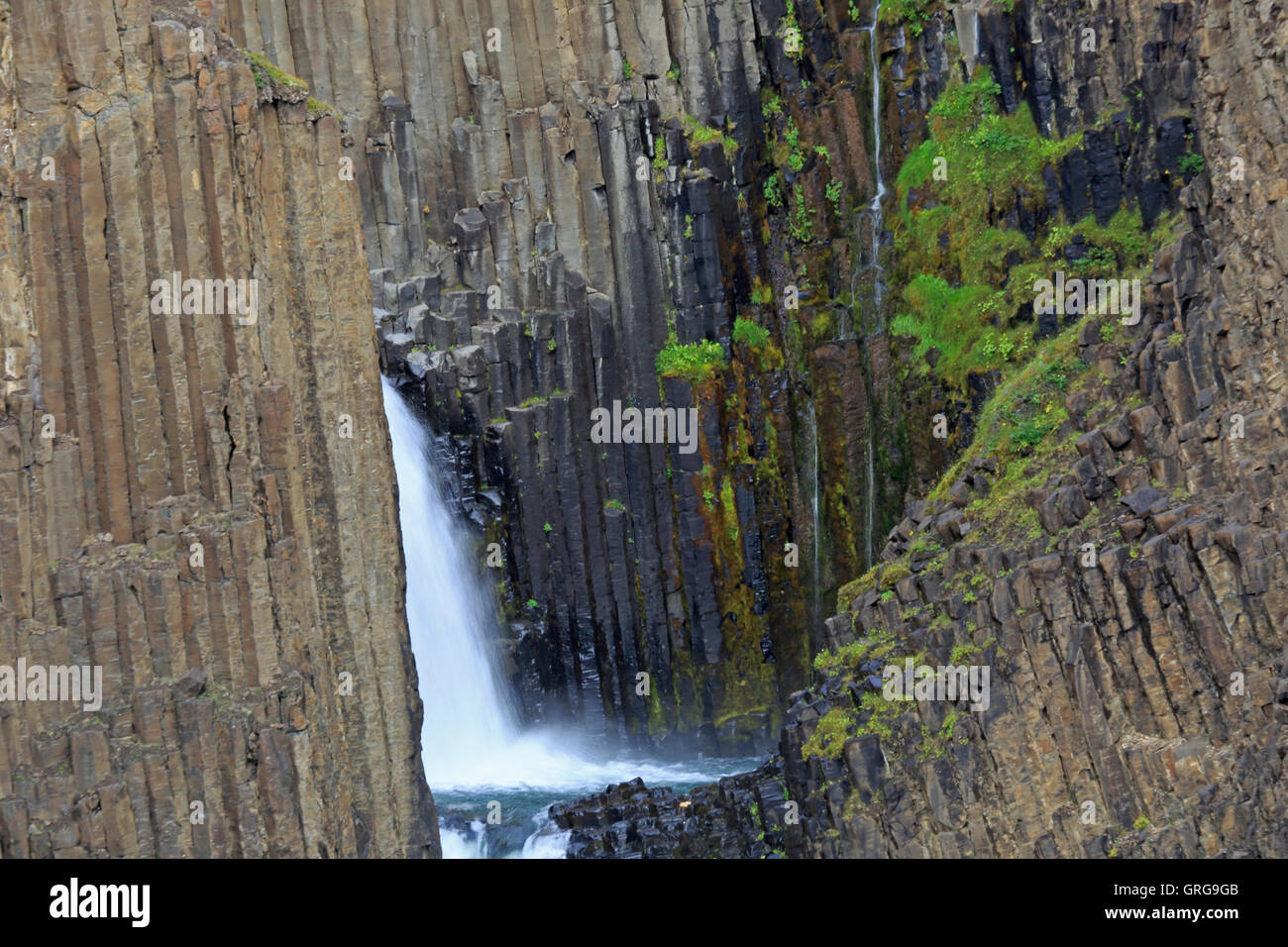 Close up view of part of Litlanesfoss waterfall showing the basalt ...
