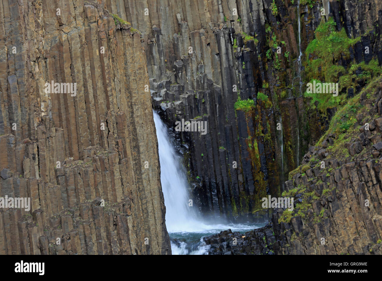 Close up view of part of Litlanesfoss waterfall showing the basalt ...