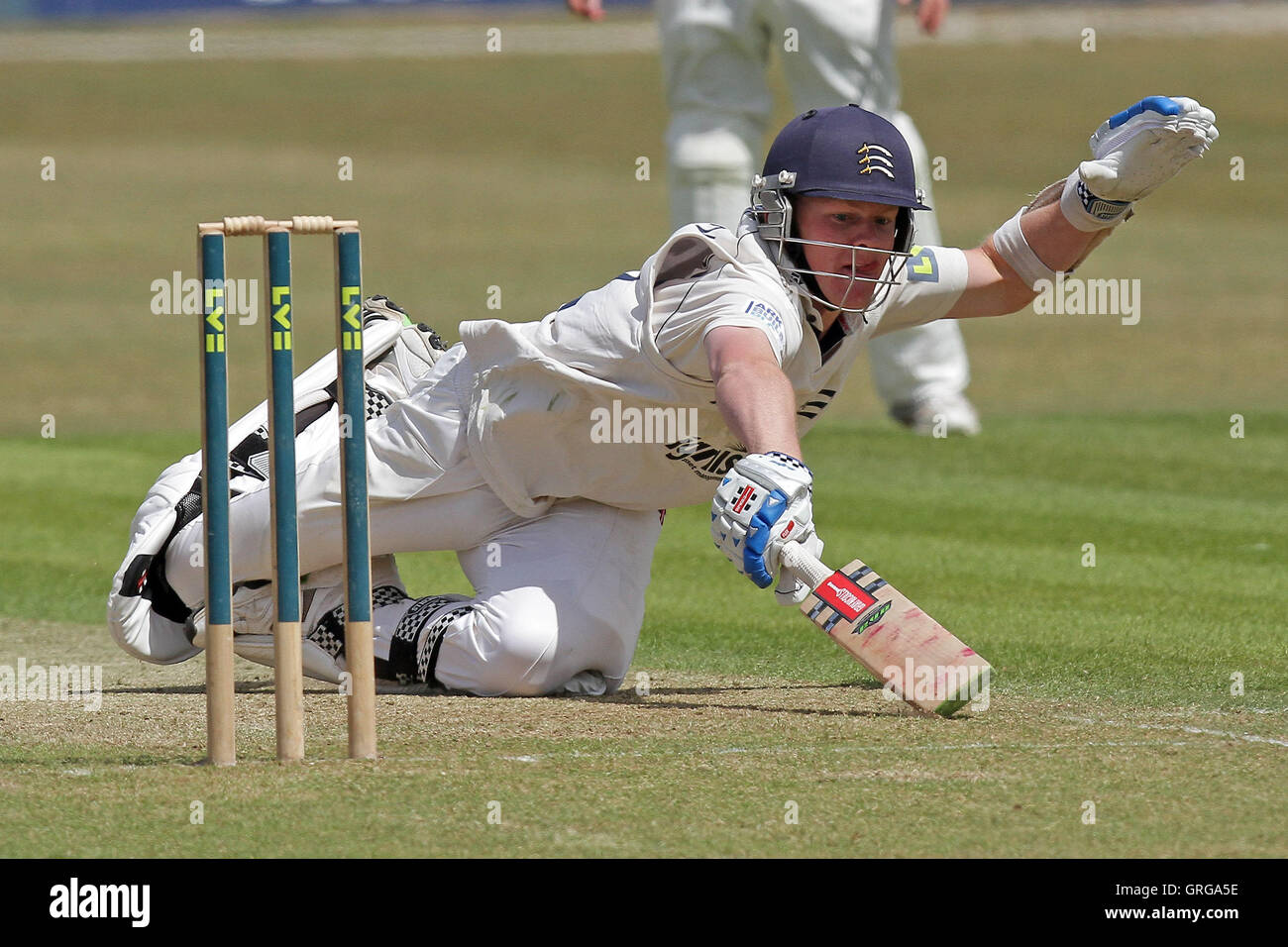 Sam Robson of Middlesex dives to make his ground - Essex CCC vs ...