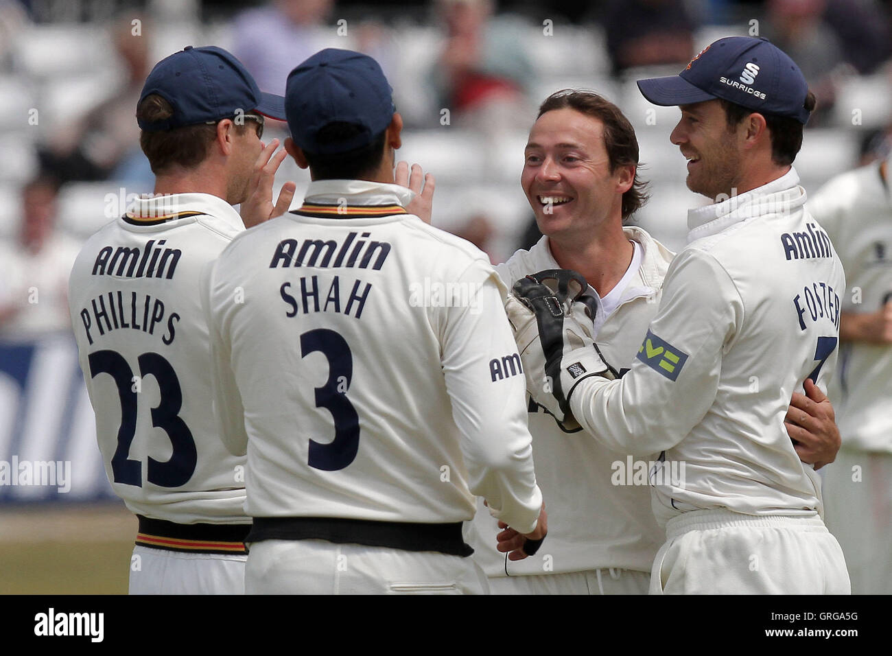 Graham Napier of Essex (2nd R) celebrates the wicket of Dawid Malan ...