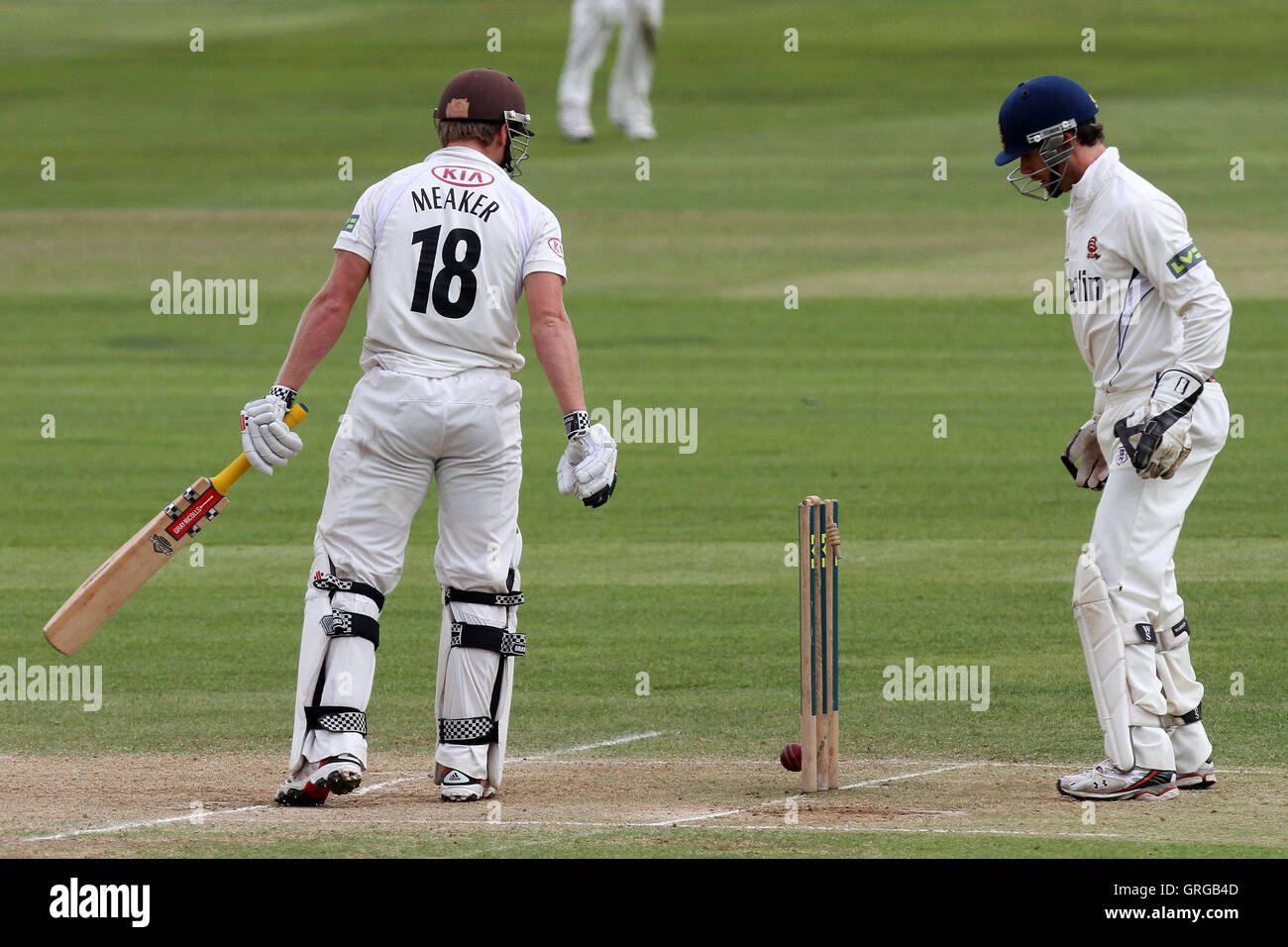 Stuart Meaker of Surrey looks back to his stumps as he is bowled out by ...