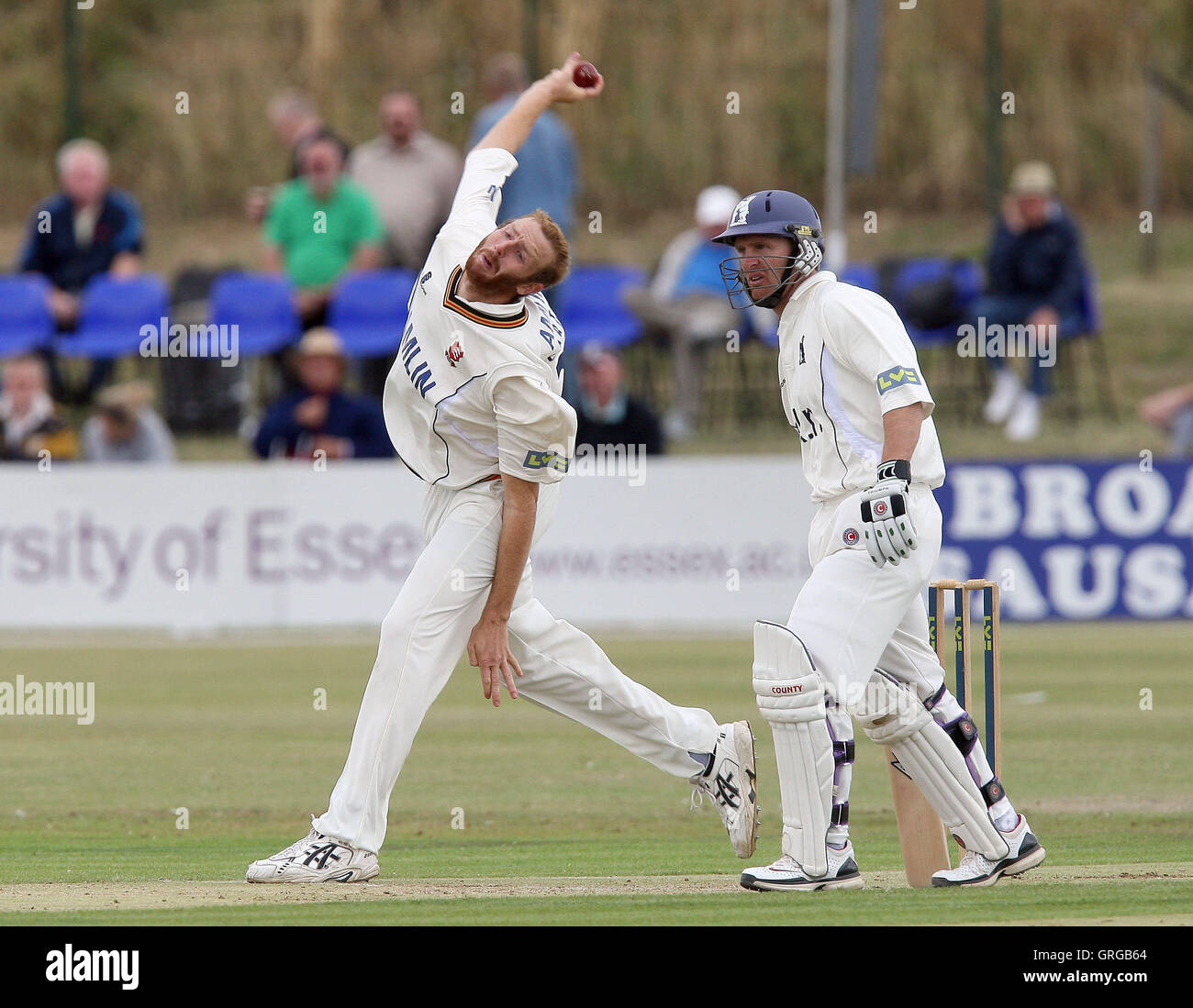 Andy Carter in bowling action for Essex as Darren Maddy looks on ...