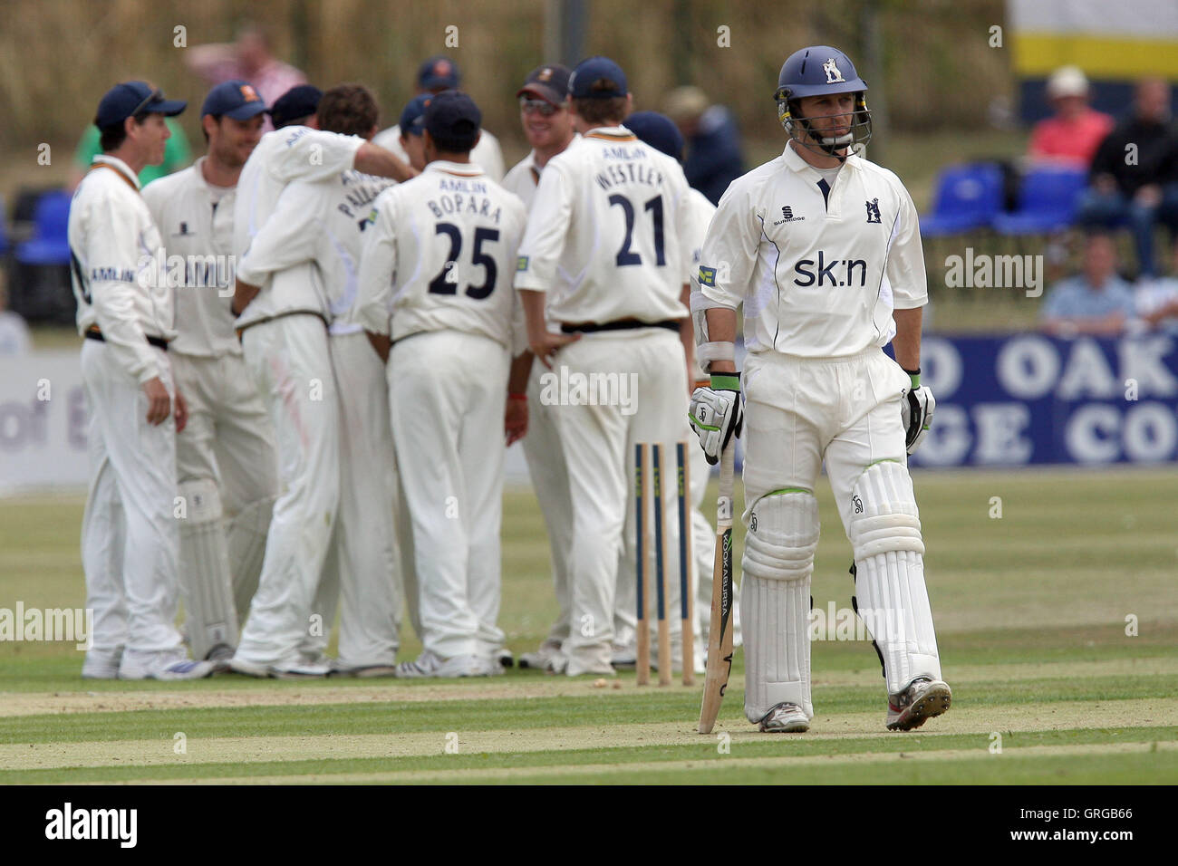 Jim Troughton of Warwickshire walks away having been bowled out by Tony ...