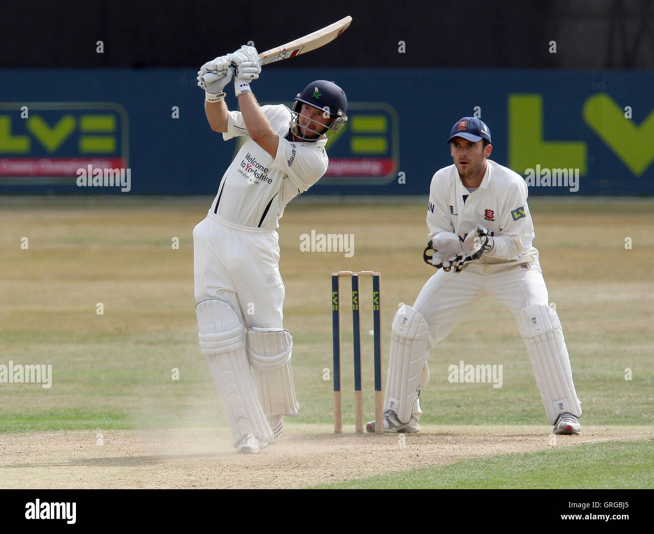 Adam Lyth of Yorkshire hits four runs as his James Foster looks on ...