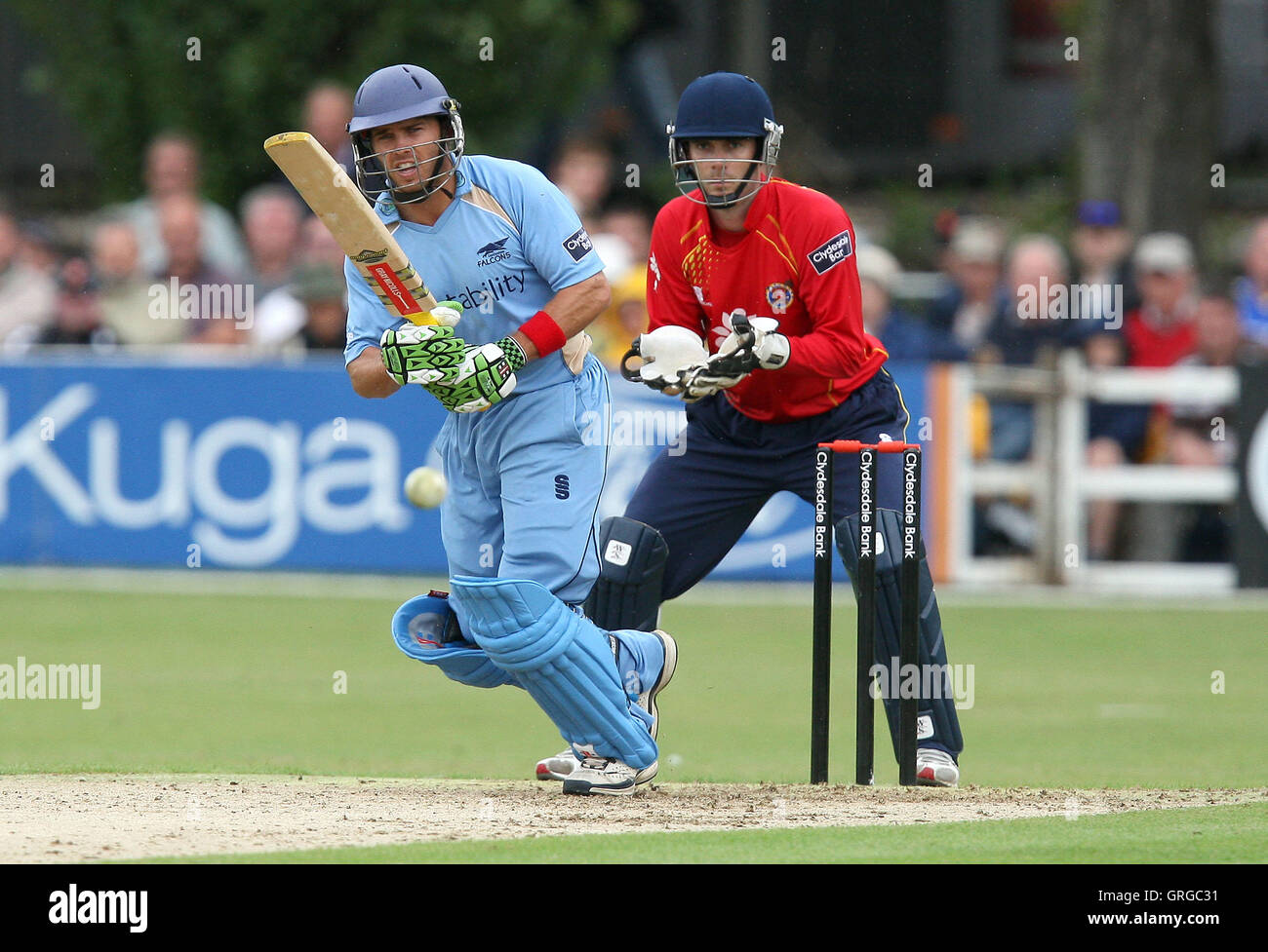 Greg Smith in batting action for Derbyshire as James Foster looks on ...