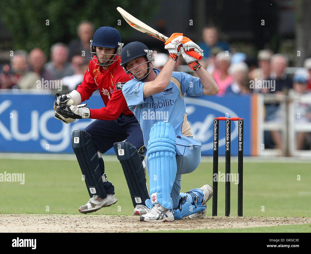 James Foster of Essex takes the ball as Graham Wagg plays and misses ...