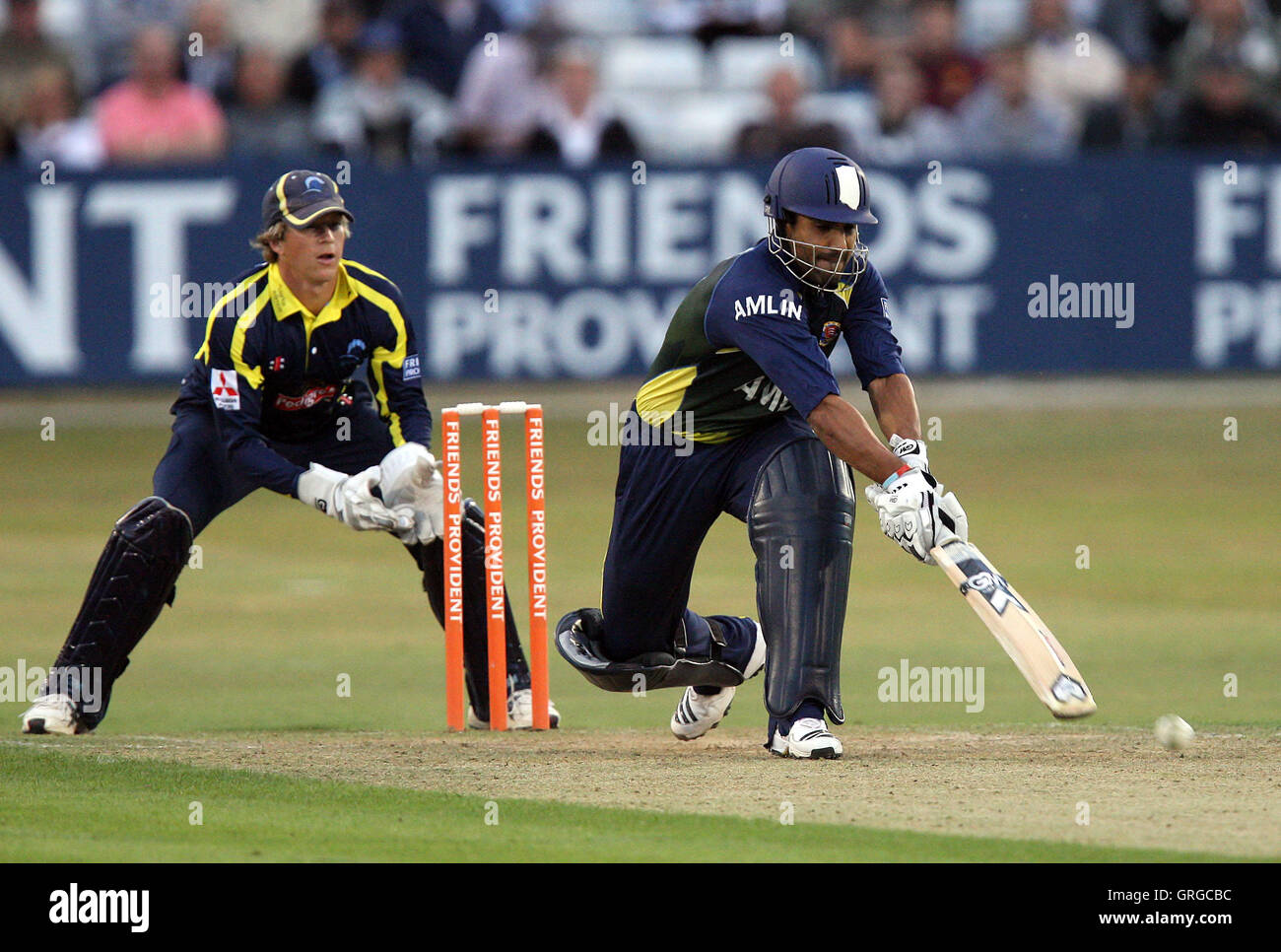 Ravi Bopara in batting action for Essex as Jonathan Batty looks on ...