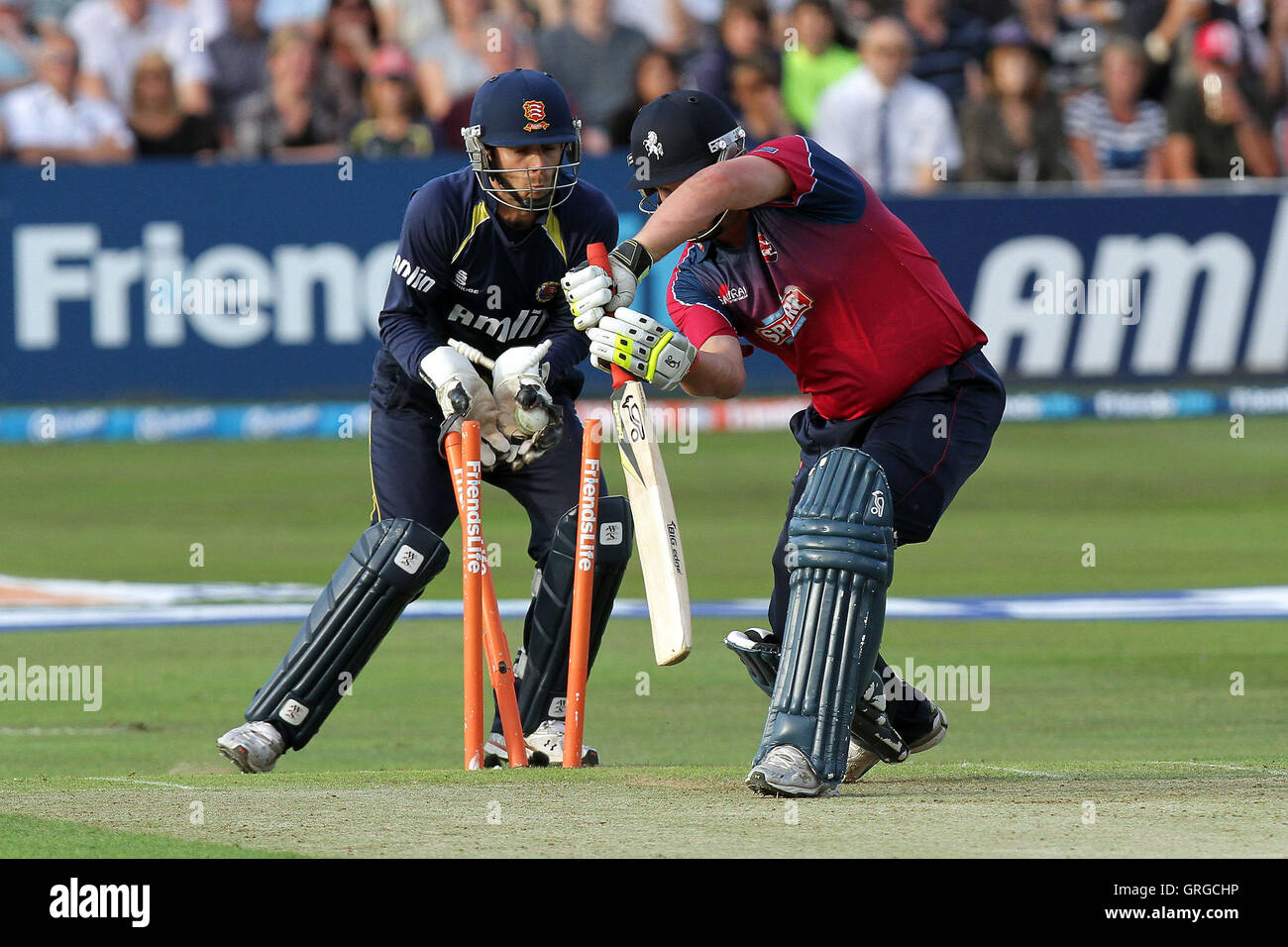Rob Key of Kent is bowled out by Ravi Bopara as James Foster looks on ...