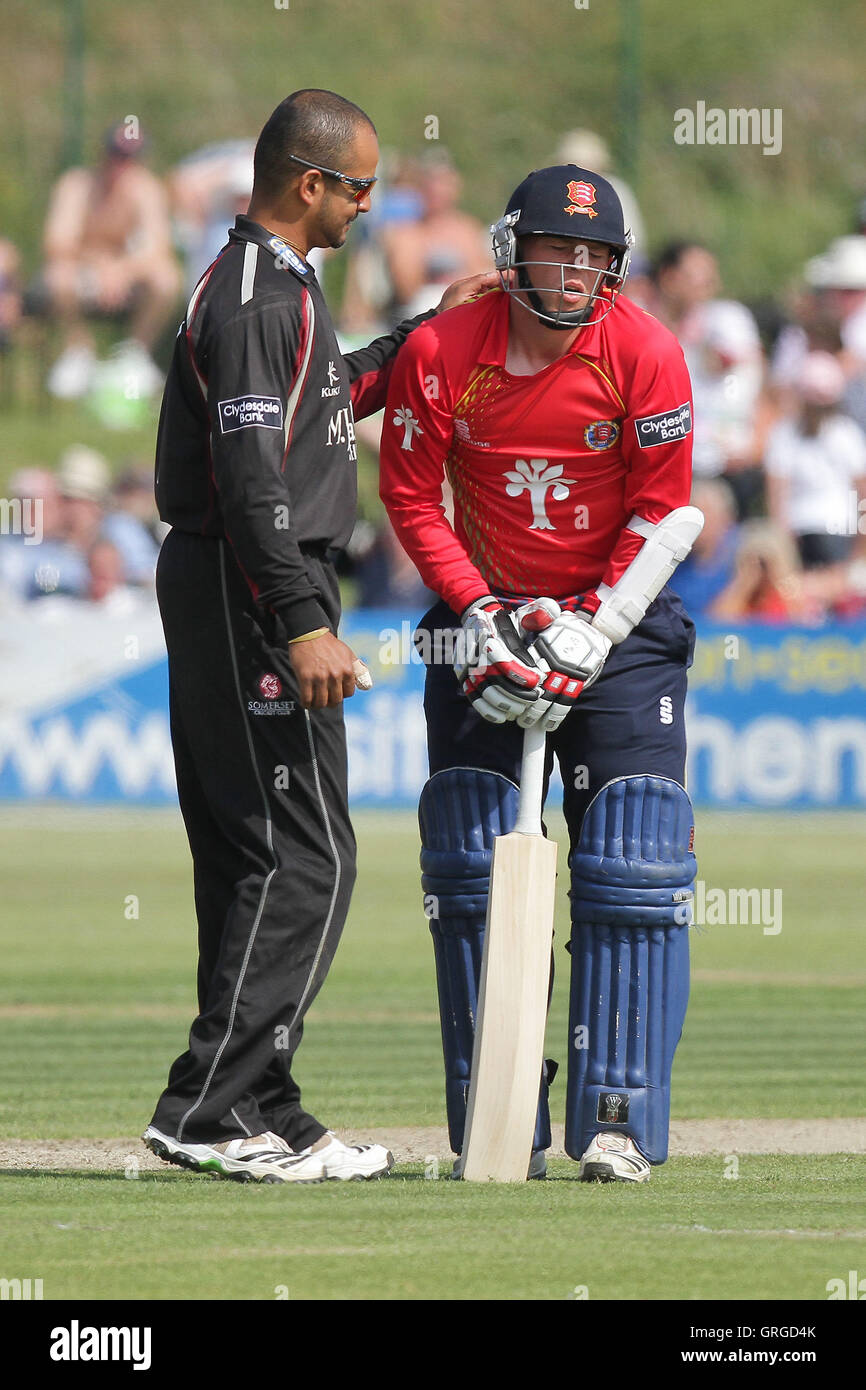 Tom Craddock of Essex recovers after taking a low blow with the ball ...