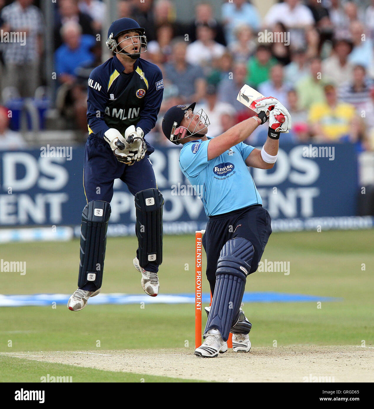 James Foster of Essex leaps as Matt Prior sends the ball skywards ...