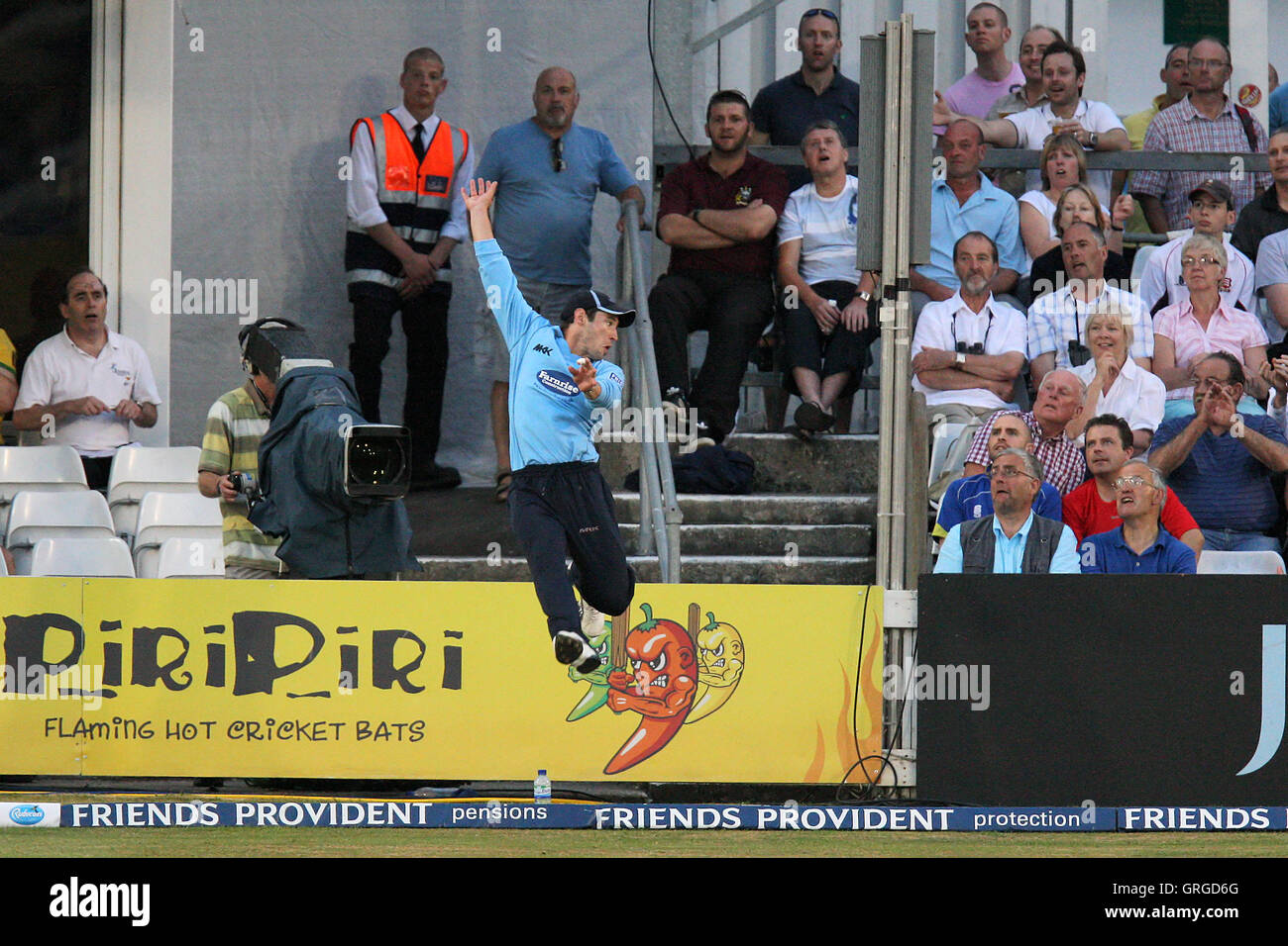 Andrew Hodd of Sussex takes a tumble while trying to take a catch and ...