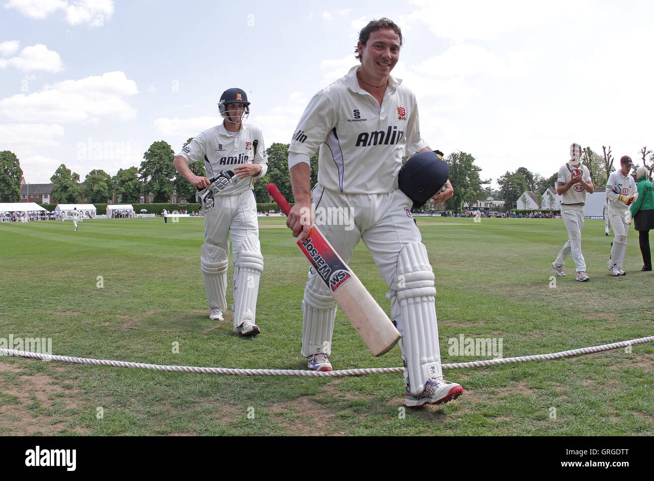 Graham Napier of Essex is all smiles as he leaves the field at lunch ...