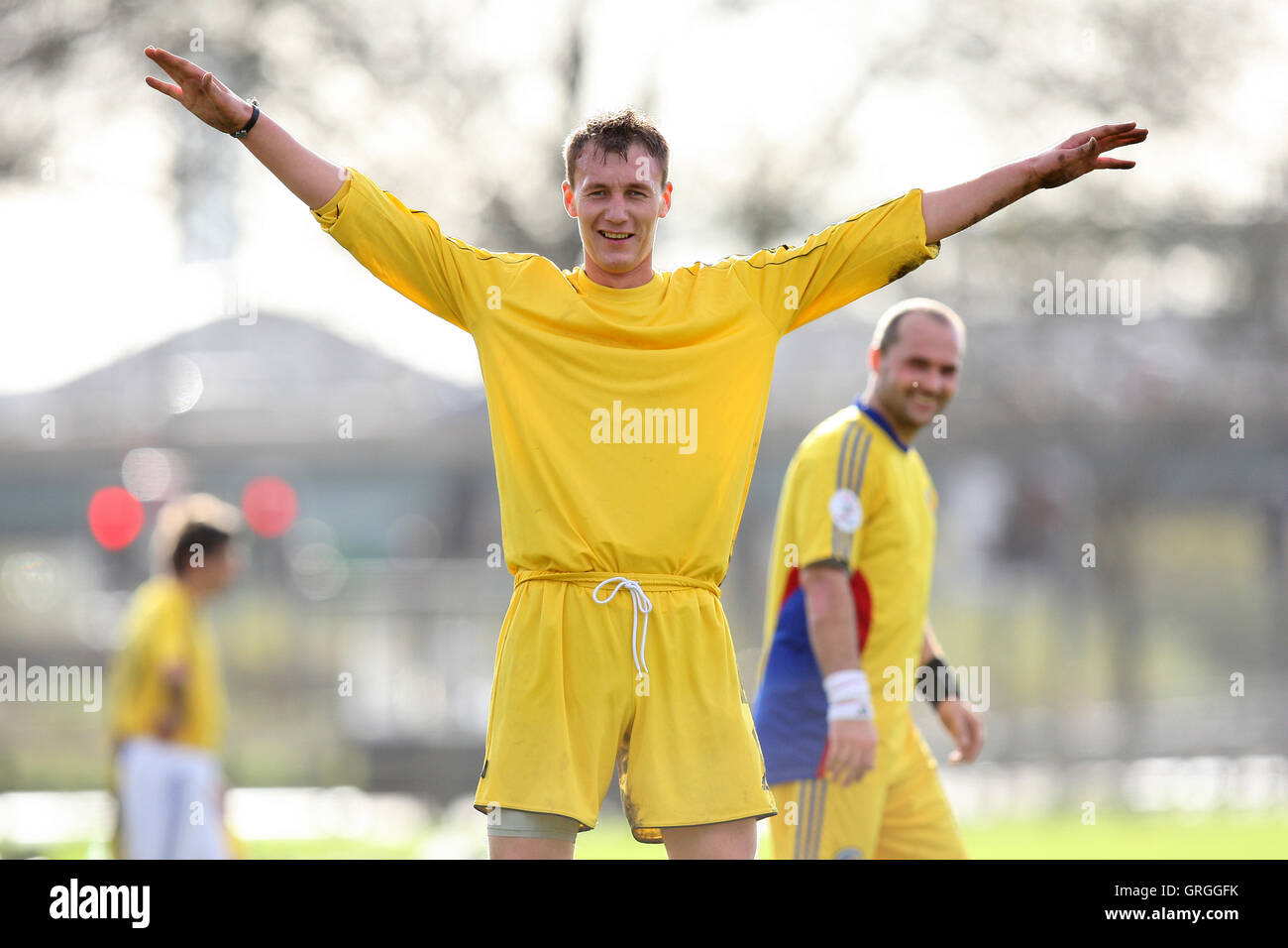 A Real Romania FC player is seen with his arms raised during a Hackney ...