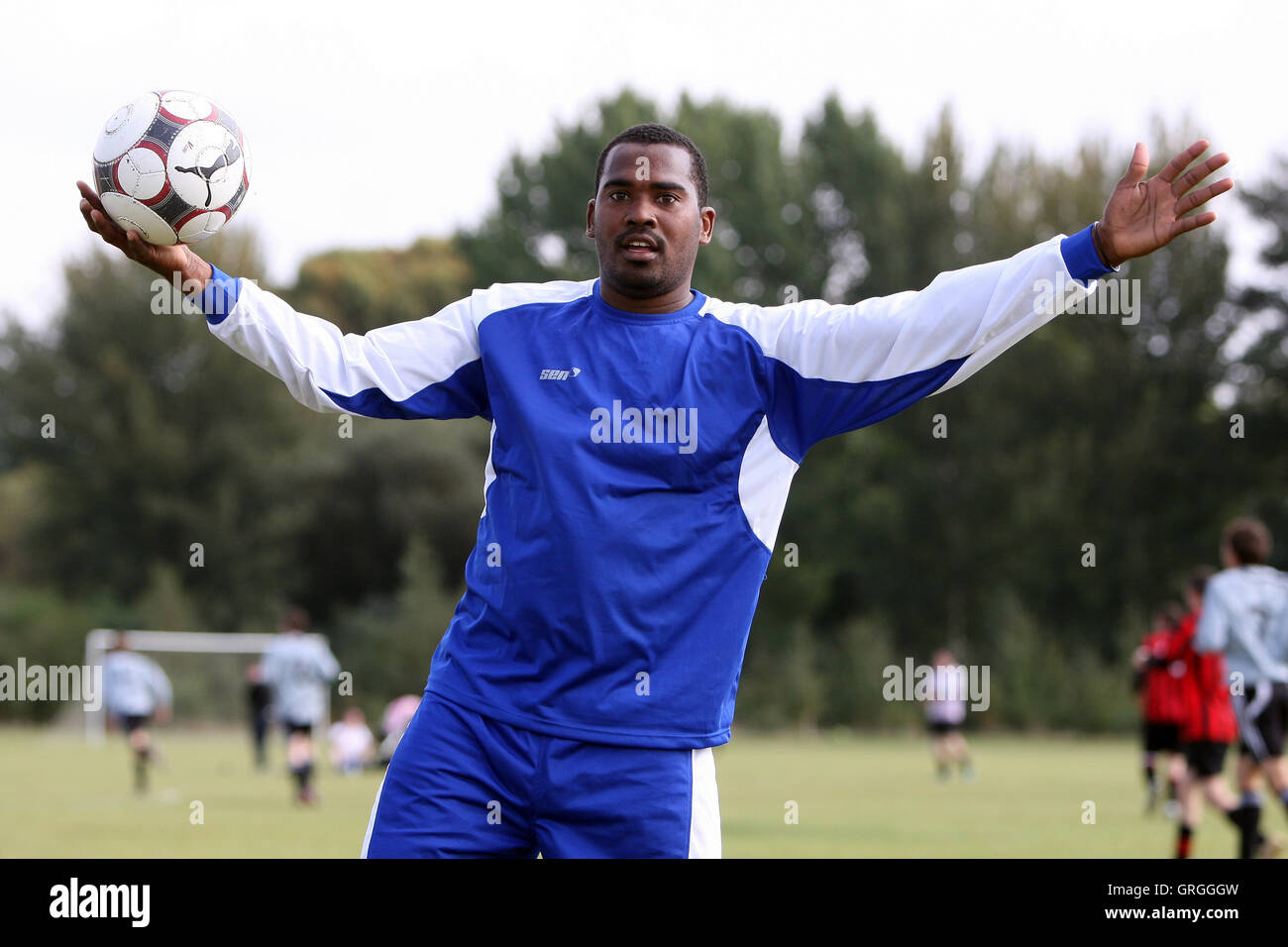 An AC Lucia player holds the ball and poses for a picture during an ...