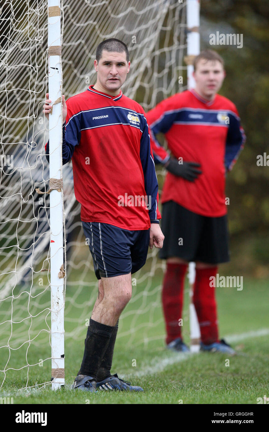 Players of Ravenscroft FC are seen in the goalmouth waiting for a ...