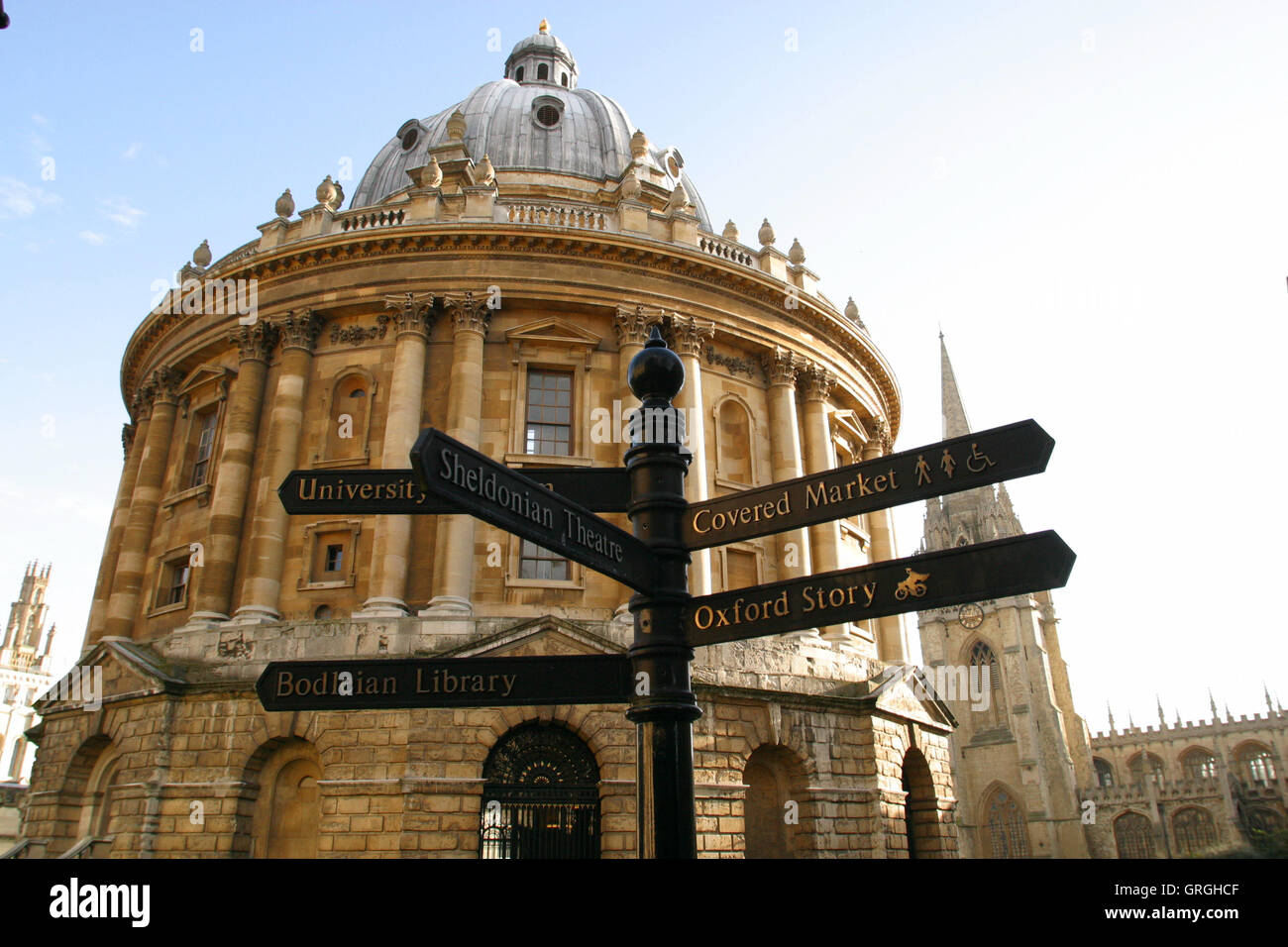 The Radcliffe Camera in Oxford with a signpost to other landmarks dates ...