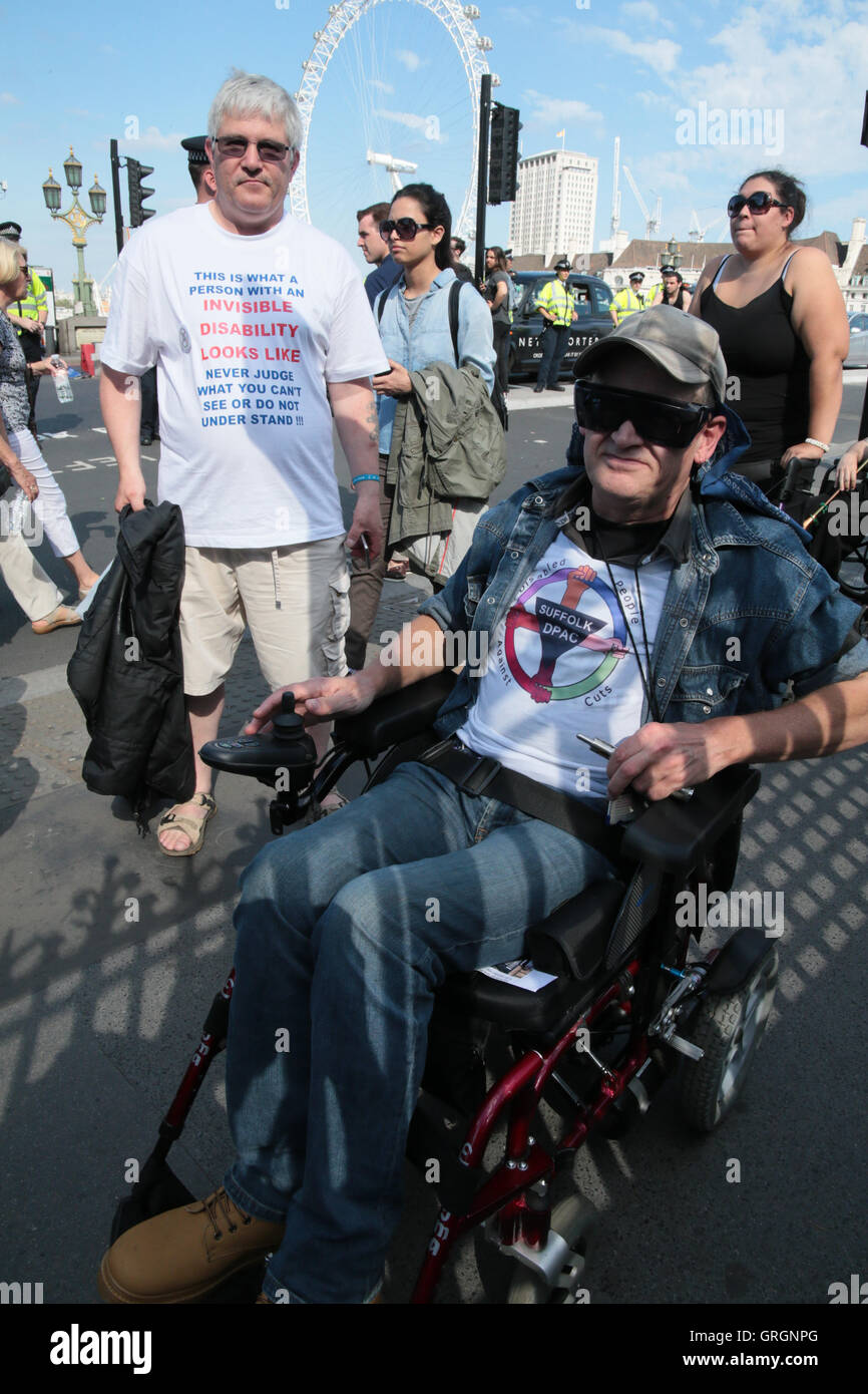 London, UK. 7th September, 2016. Disabled protesters sat in the middle ...