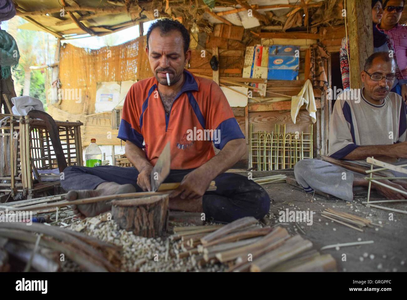 Cairo, Egypt. 7th Sep, 2016. An Egyptian man weaves straw-traditional ...