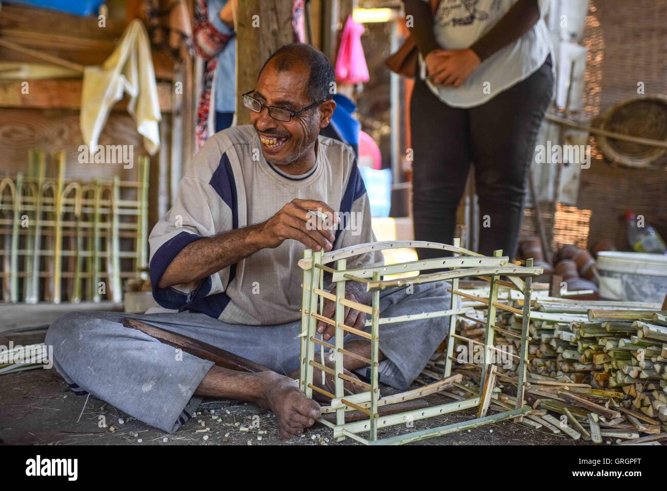 Cairo, Egypt. 7th Sep, 2016. An Egyptian man weaves straw-traditional ...